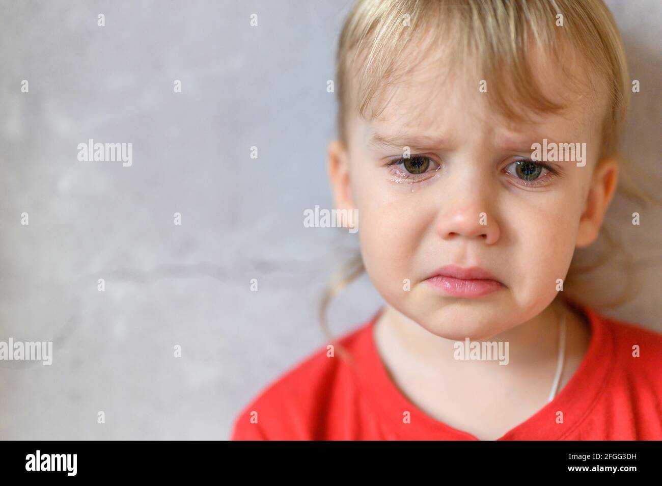 kid crying. the face of a cute little upset four year old baby boy in ...