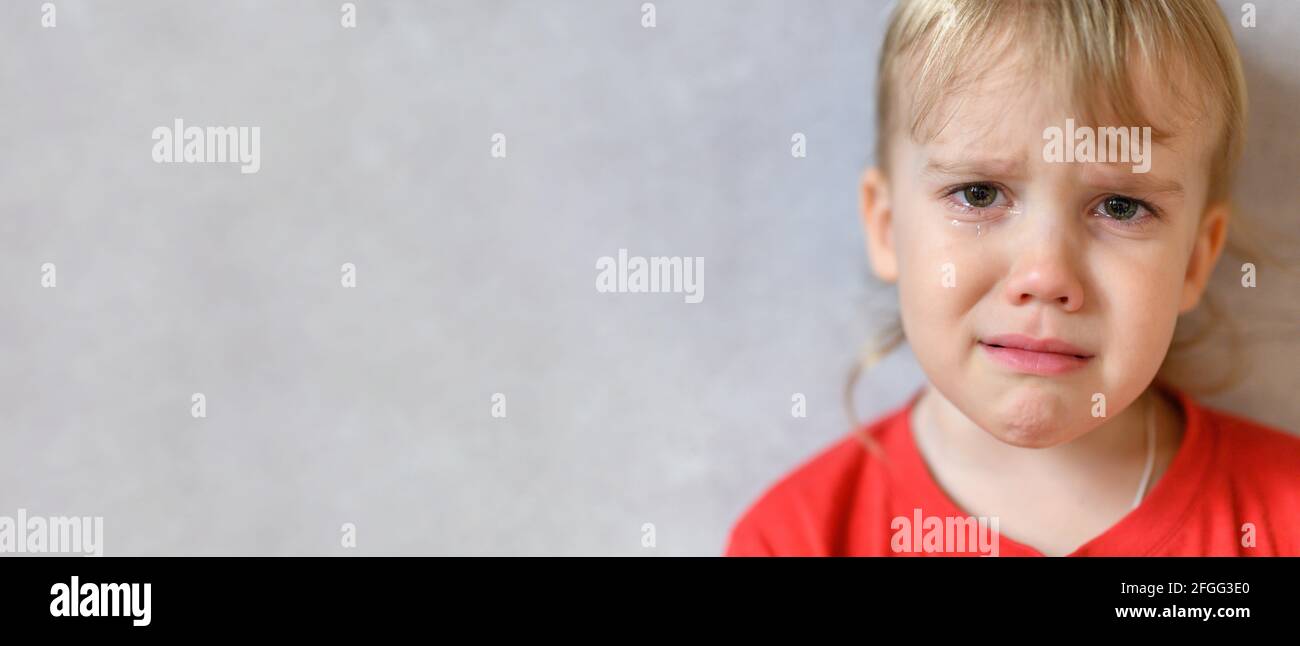 kid crying. the face of a cute little upset four year old baby boy in ...