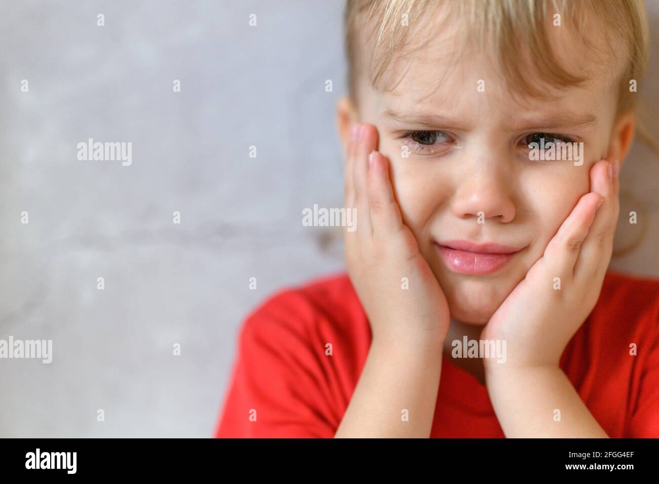 kid crying. the face of a cute little upset four year old baby boy in ...