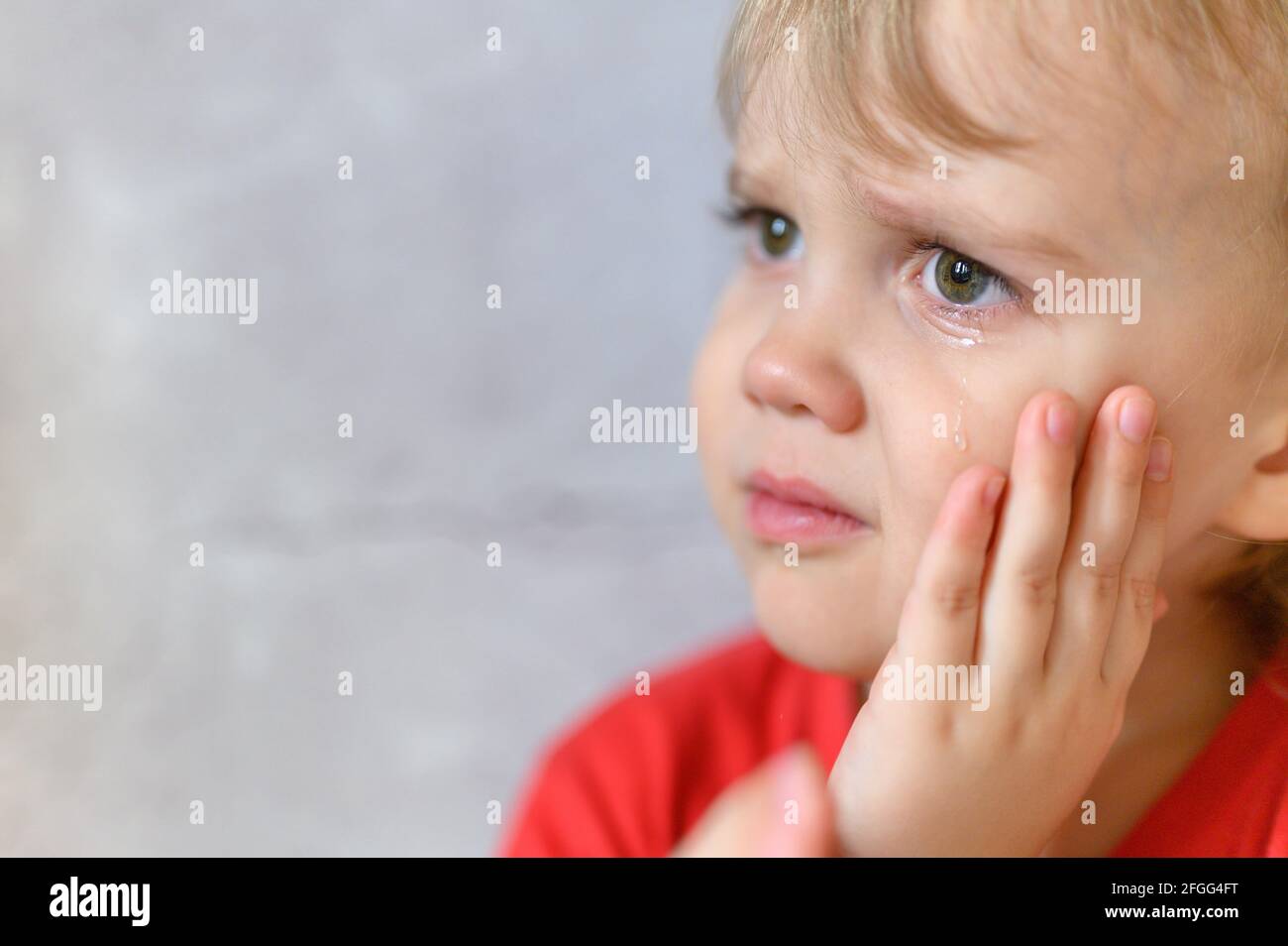 kid crying. the face of a cute little upset four year old baby boy in ...