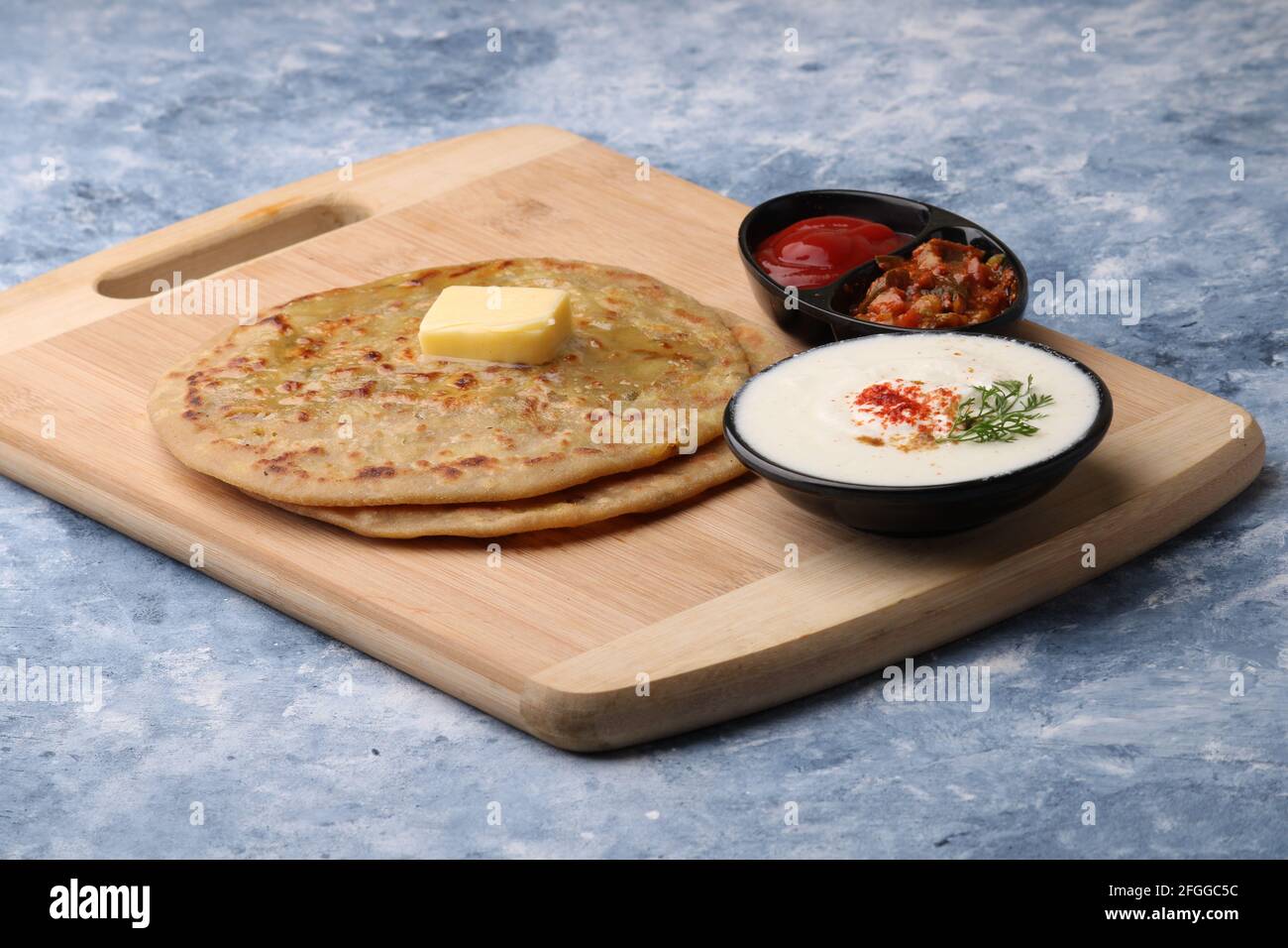 Traditional Indian food Aloo paratha or potato stuffed flat bread ...