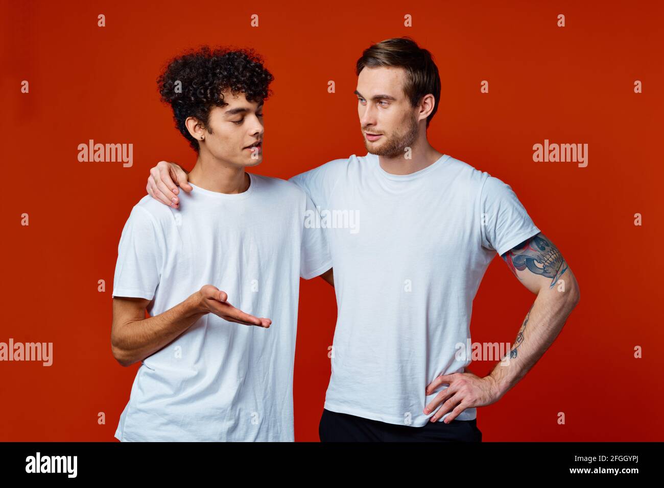 two men hugging friendship communication lifestyle fun Stock Photo - Alamy
