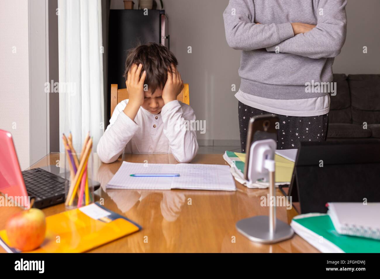 boy doing his homework while lock down, studying remotely Stock Photo ...