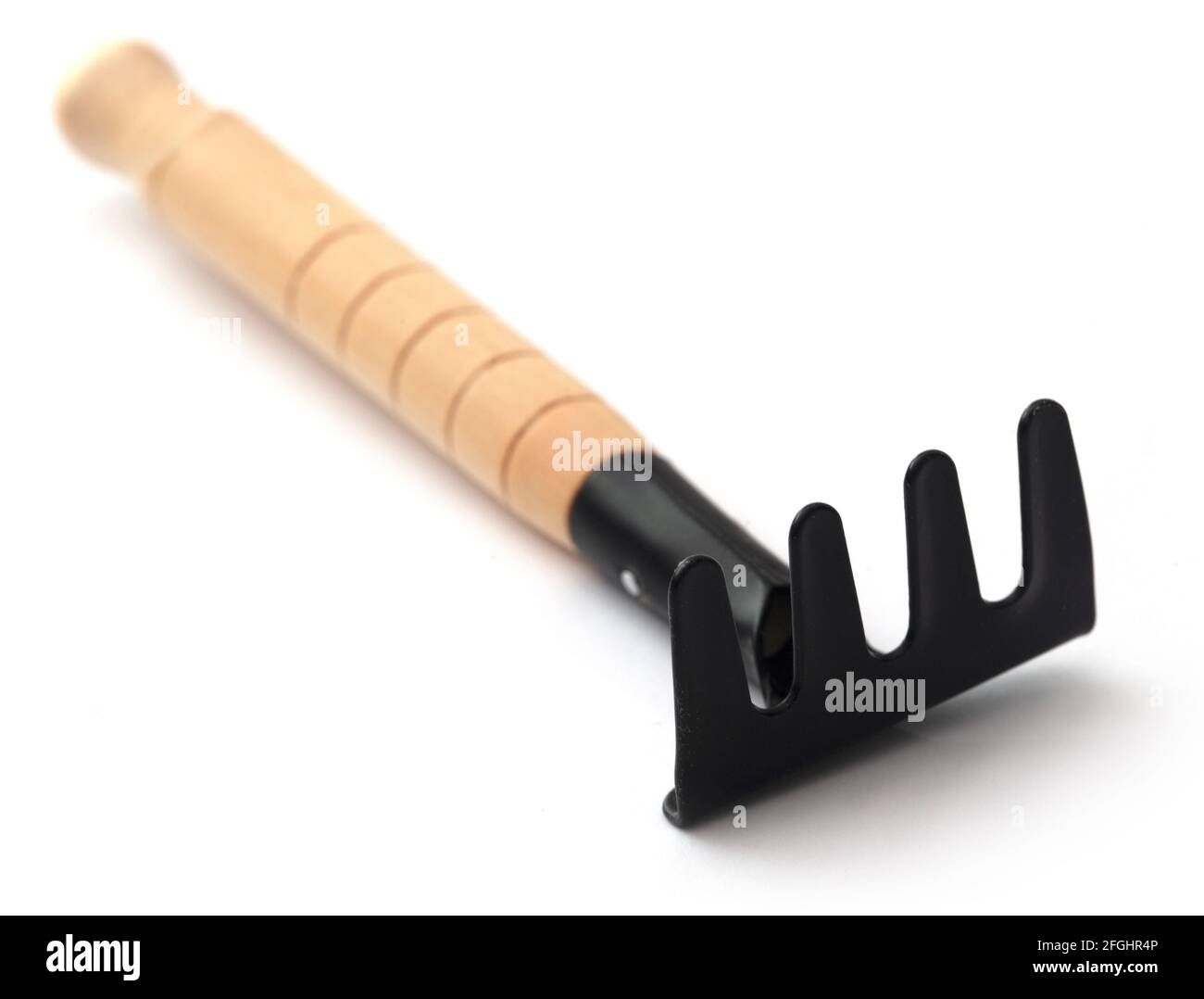Garden tool Rake over white background Stock Photo - Alamy