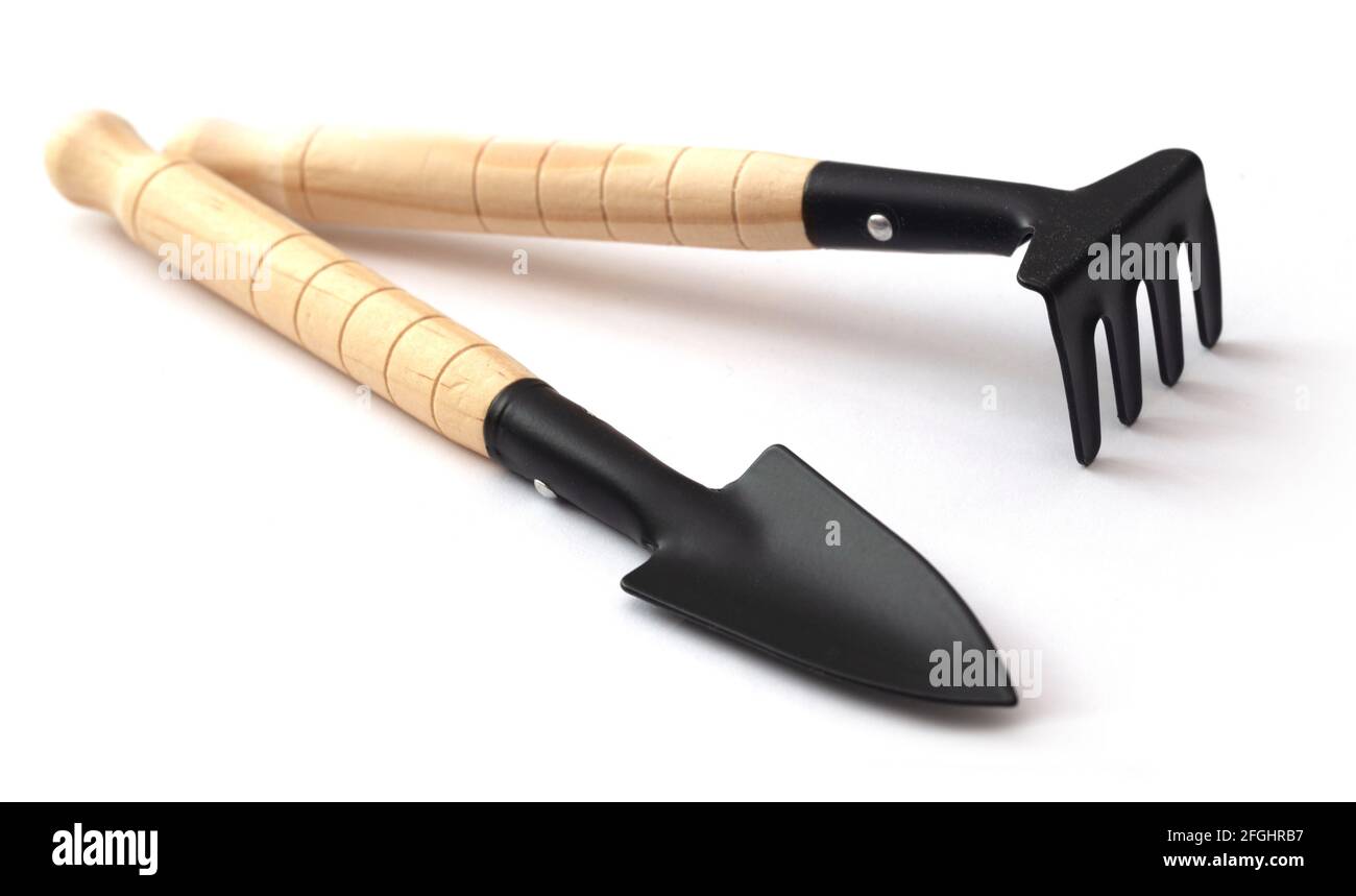Garden tool Shovel and Rake over white background Stock Photo - Alamy