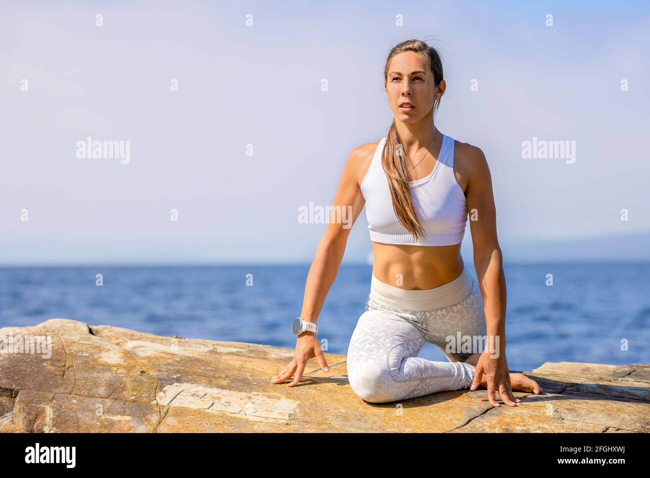 Athletic Woman Doing Outdoor Yoga Stretching Workout Stock Photo - Alamy
