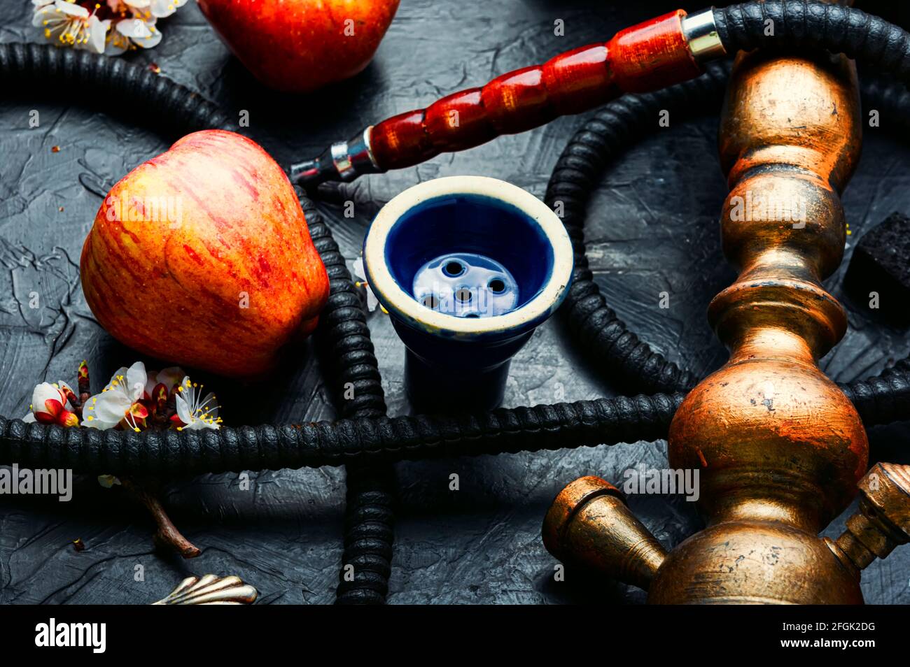 Oriental smoking hookah on tobacco with apple flavor.Apple shisha ...