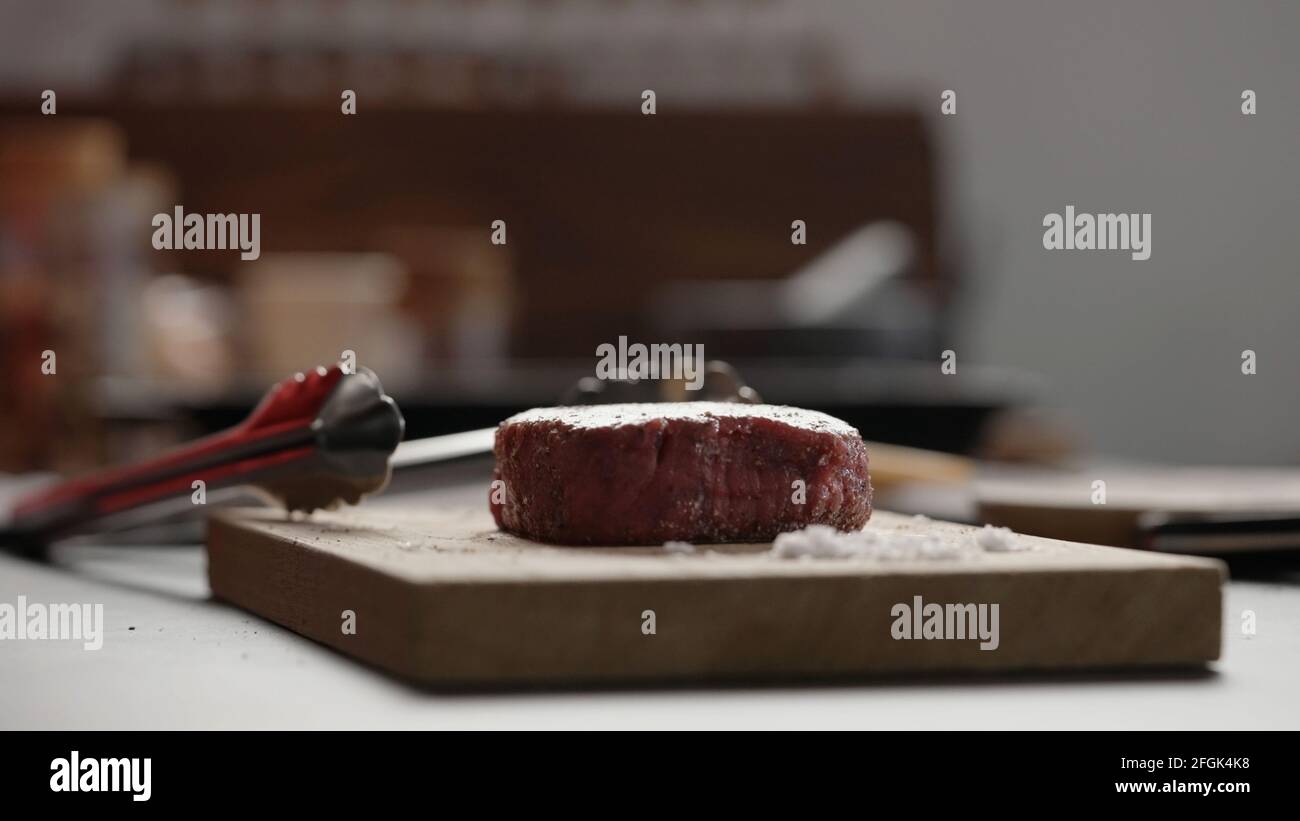 raw beef steak resting on oak board closeup, wide photo Stock Photo - Alamy