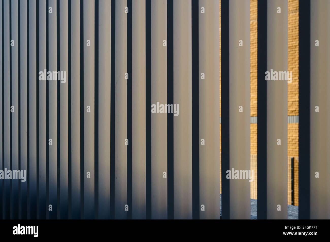 Metal fence with large bars presenting vertical line pattern Stock ...