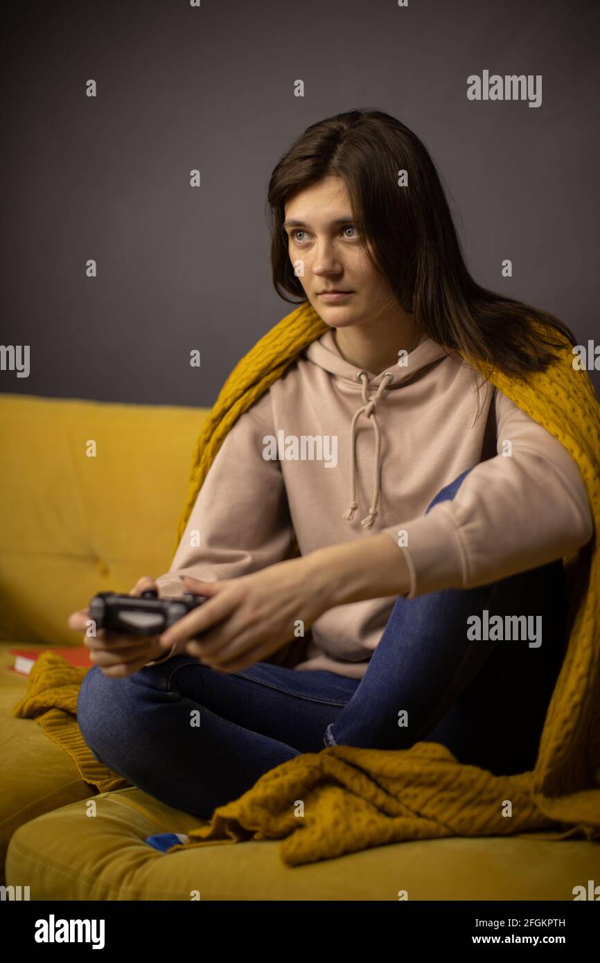 Crazy obsessed with games lady plays video game holding console gamepad ...