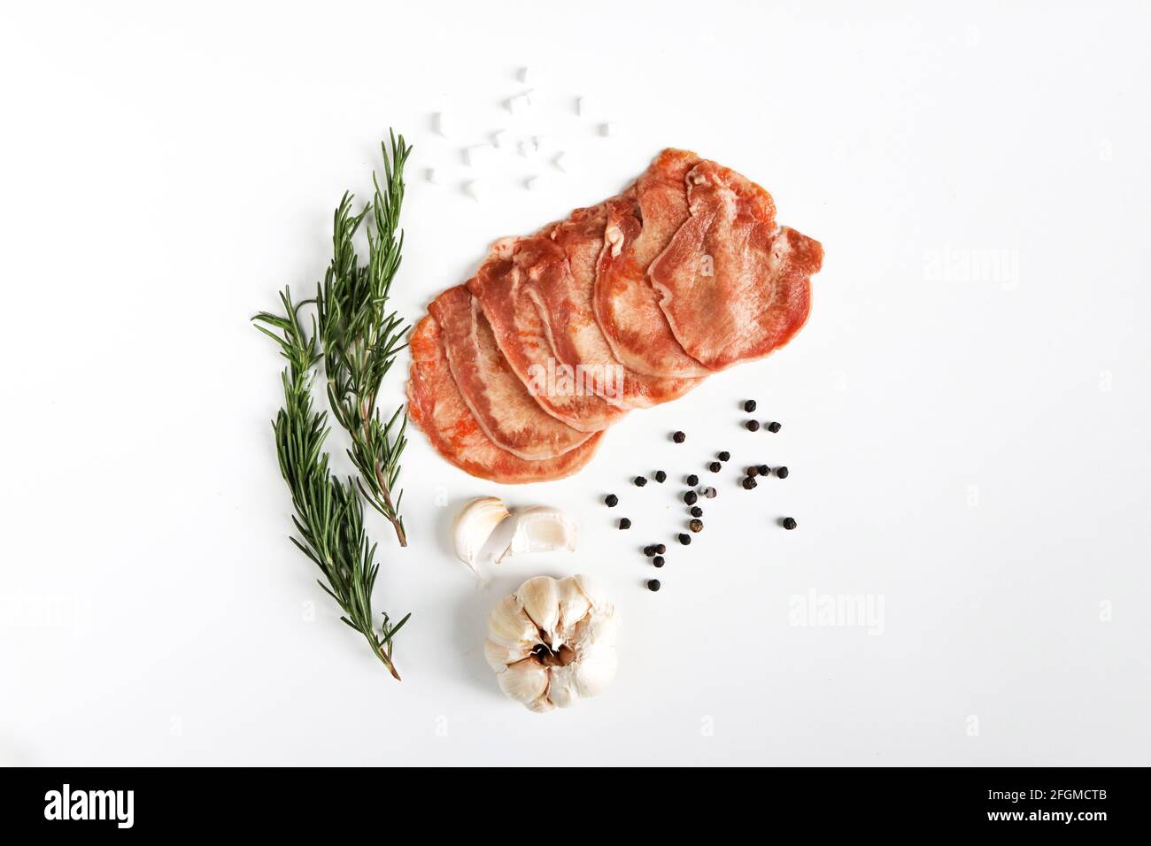 Raw meat in flat lay style with seasoning and garnish Stock Photo - Alamy