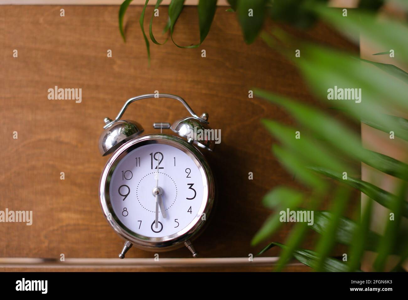 Antique clock in wooden background Stock Photo - Alamy