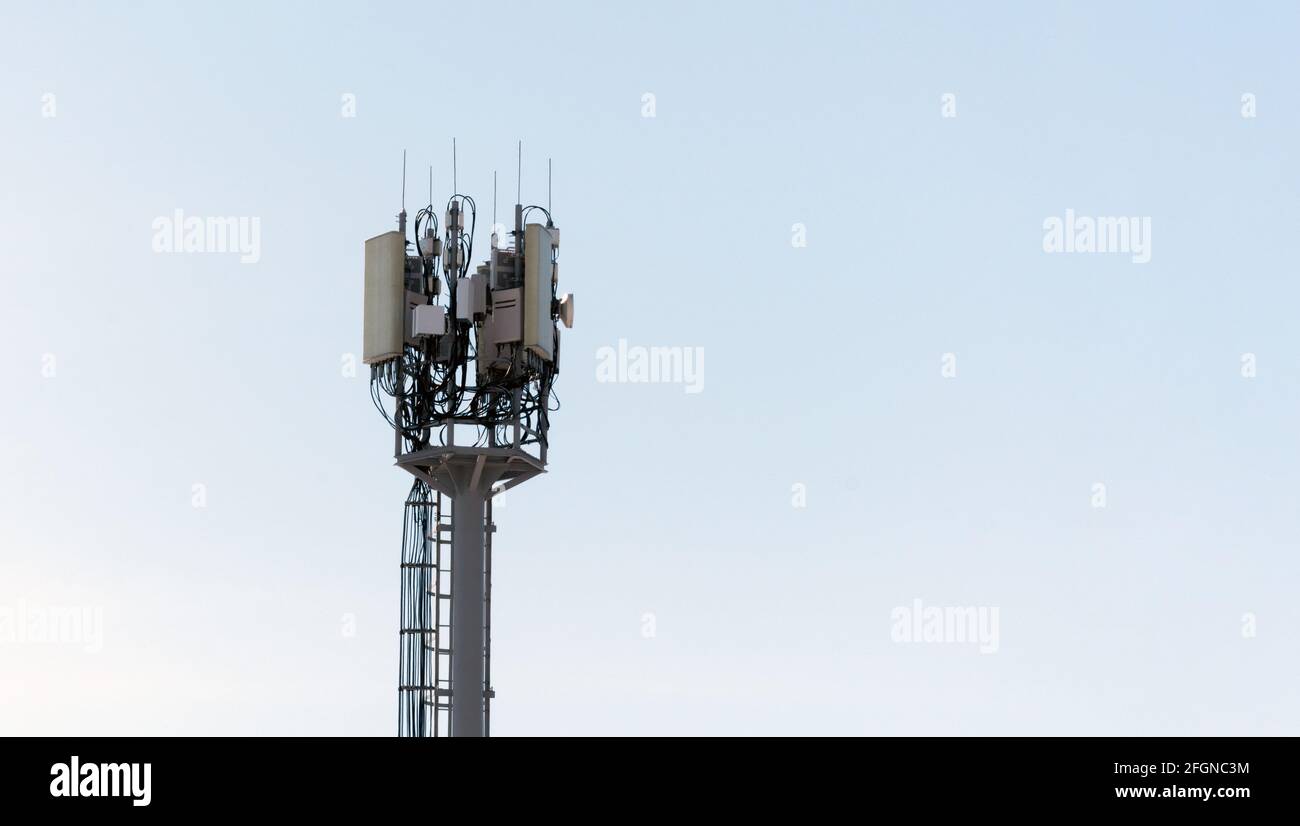 Telecommunication tower with blue and cloudy sky. Copy space 4G, 5G Stock Photo - Alamy