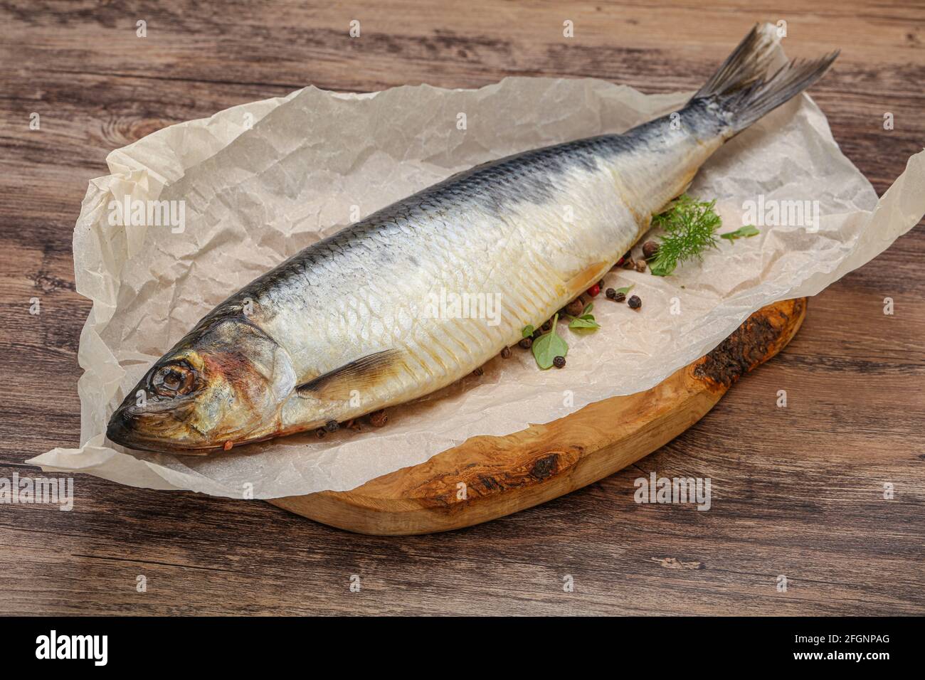 Salted Herring fish with pepper and spices Stock Photo - Alamy