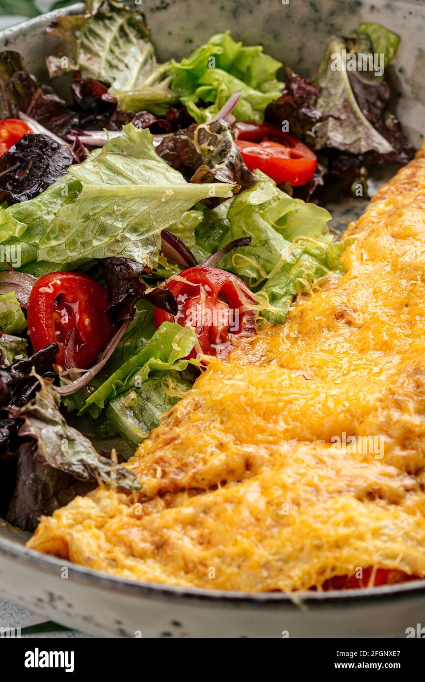 Rustic omelette with vegetables salad Stock Photo - Alamy