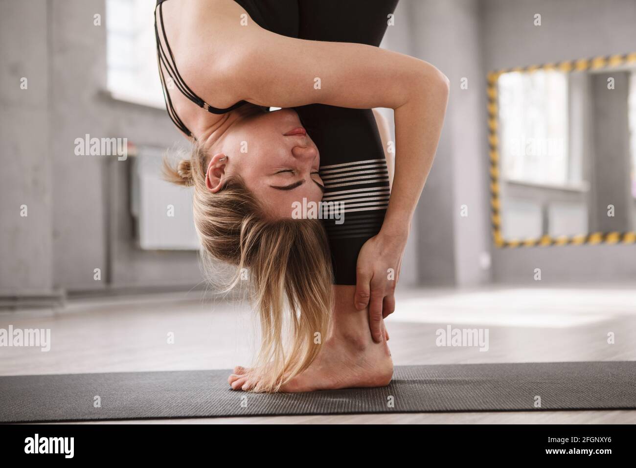 Calm young athlete stretching legs hi-res stock photography and images ...
