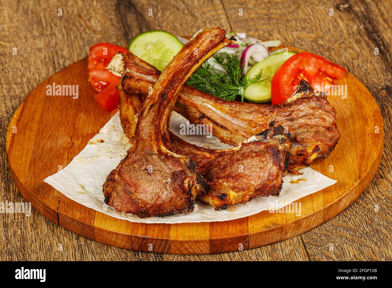 Grilled lamb barbeque served vegetables and onion Stock Photo - Alamy