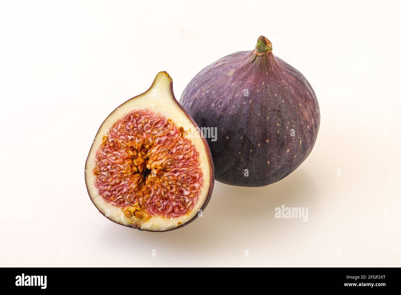 Sweet purple slice of fig fruit Stock Photo - Alamy