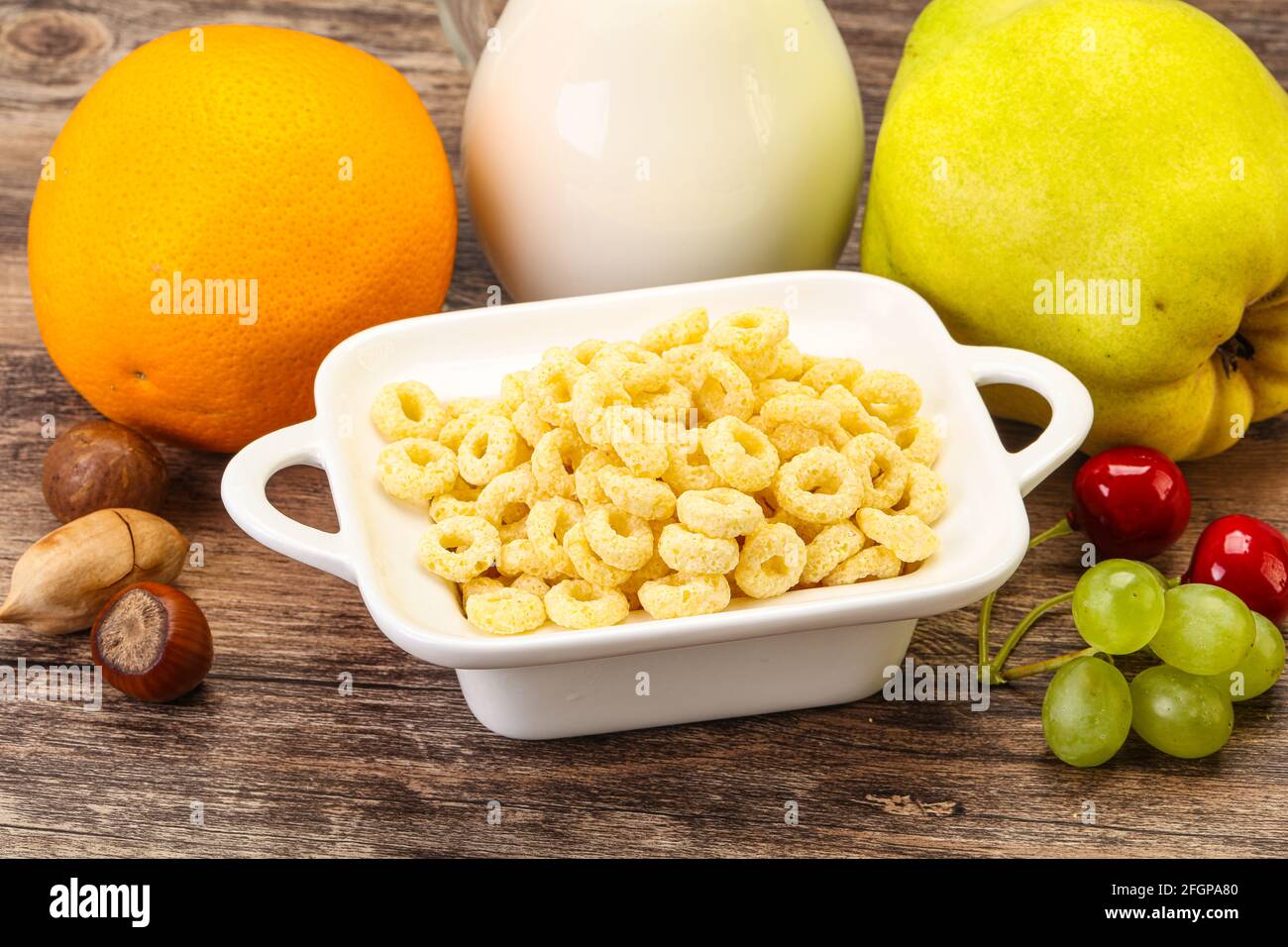 Breakfast with corn rings, fruits and milk Stock Photo - Alamy