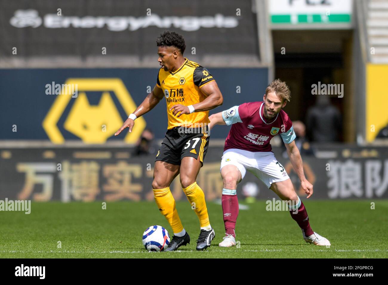 Adama Traore #37 of Wolverhampton Wanderers and Charlie Taylor #3 of ...