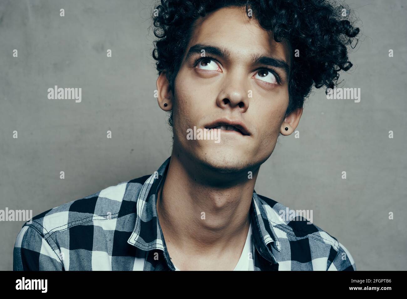 cute guy number shirt fun hair curly hair close up Stock Photo - Alamy