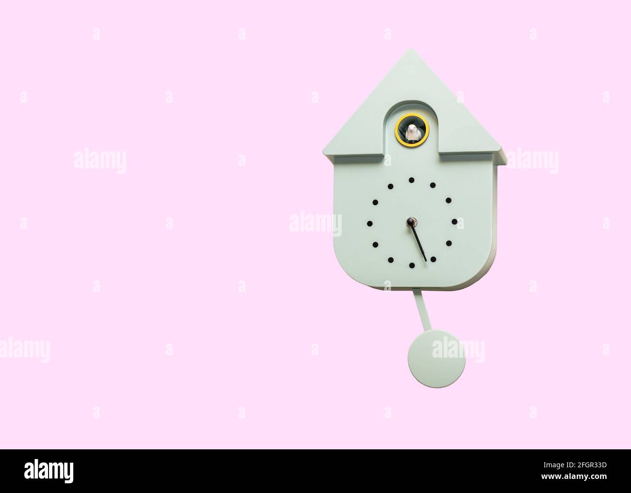 Close up view of wall cuckoo clock on pink background. Sweden Stock ...
