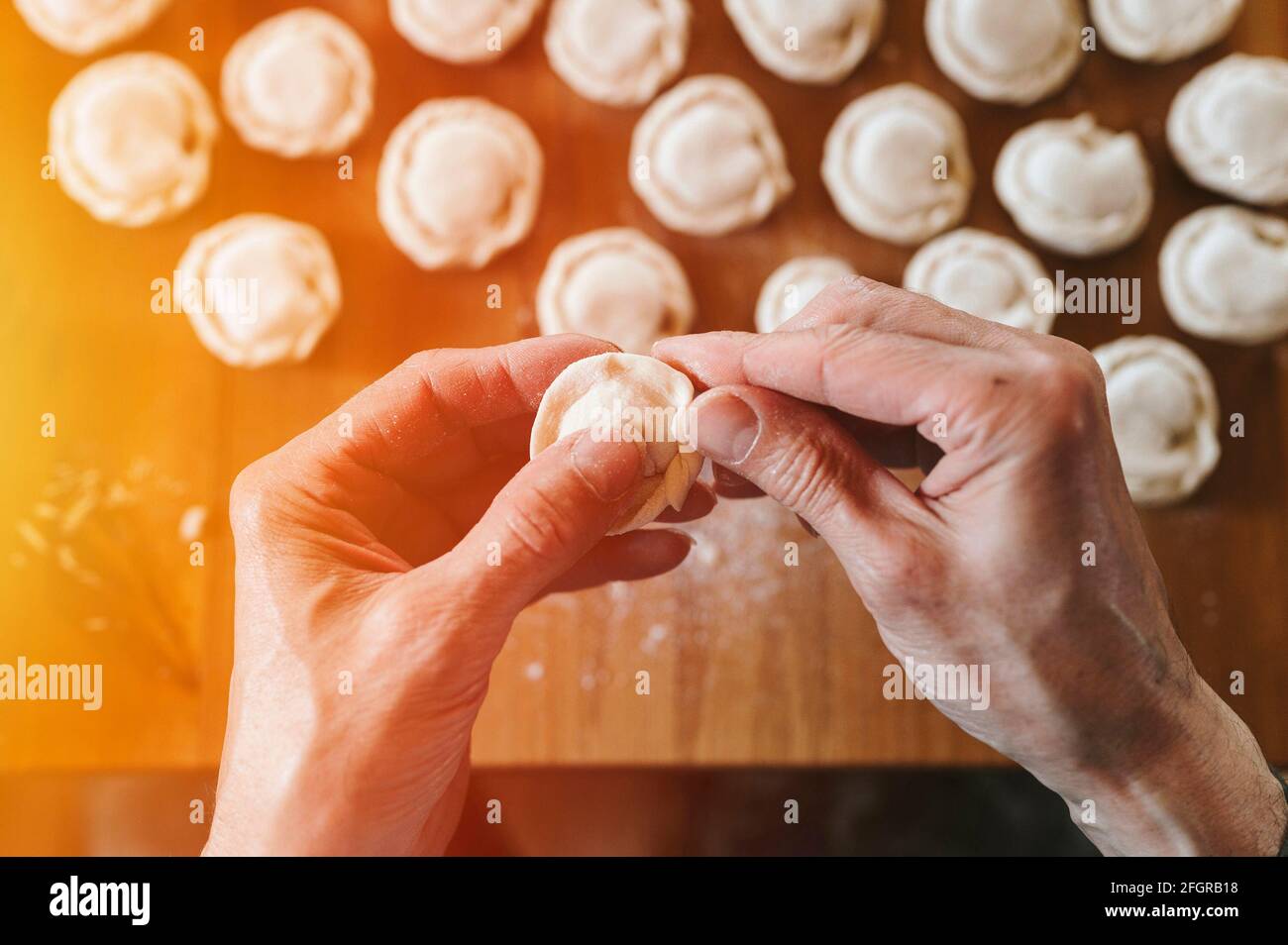 Male hands preparing dumplings pelmeni hi-res stock photography and ...