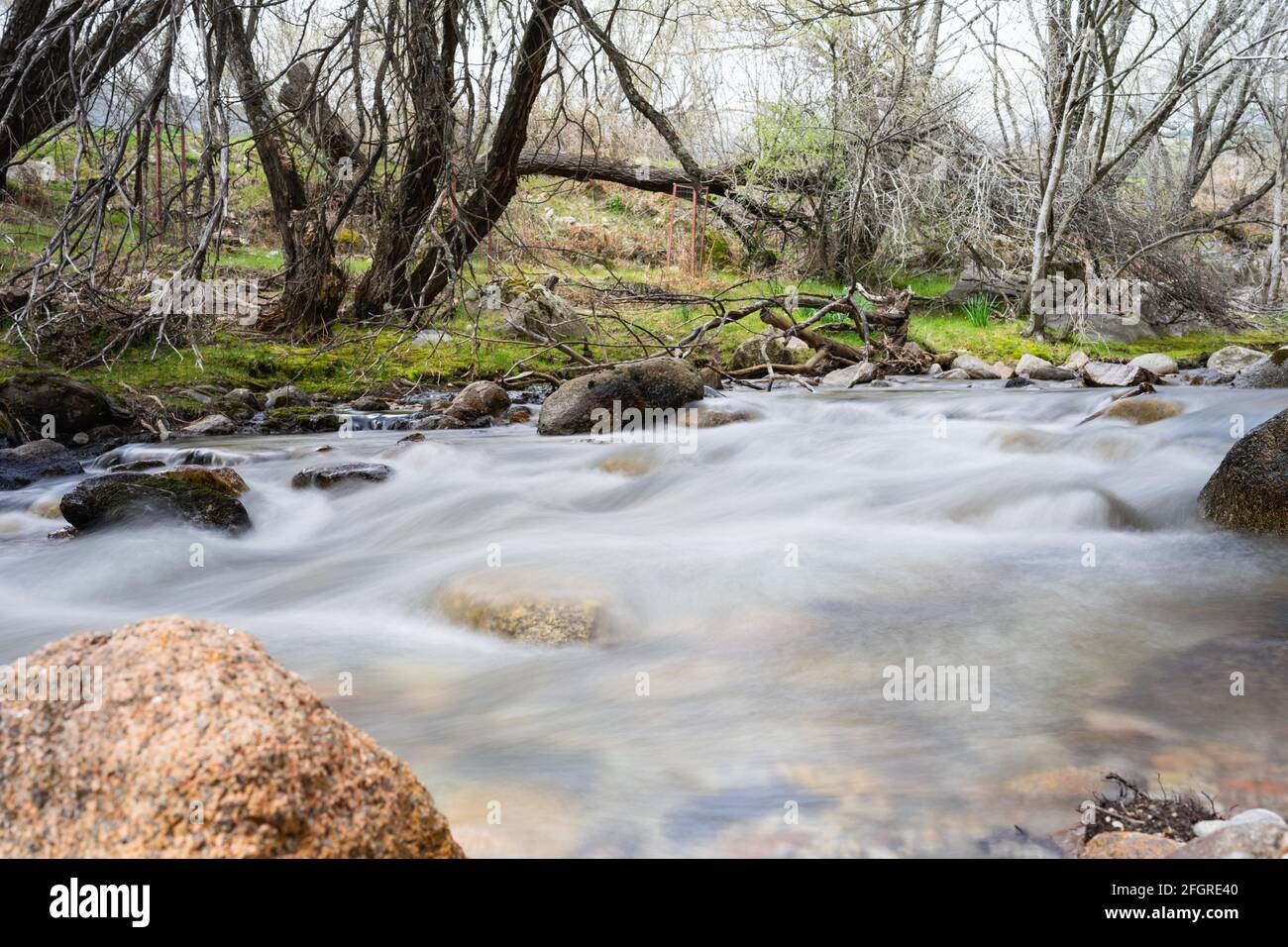 Detail of water flowing over rocks in creek hi-res stock photography ...