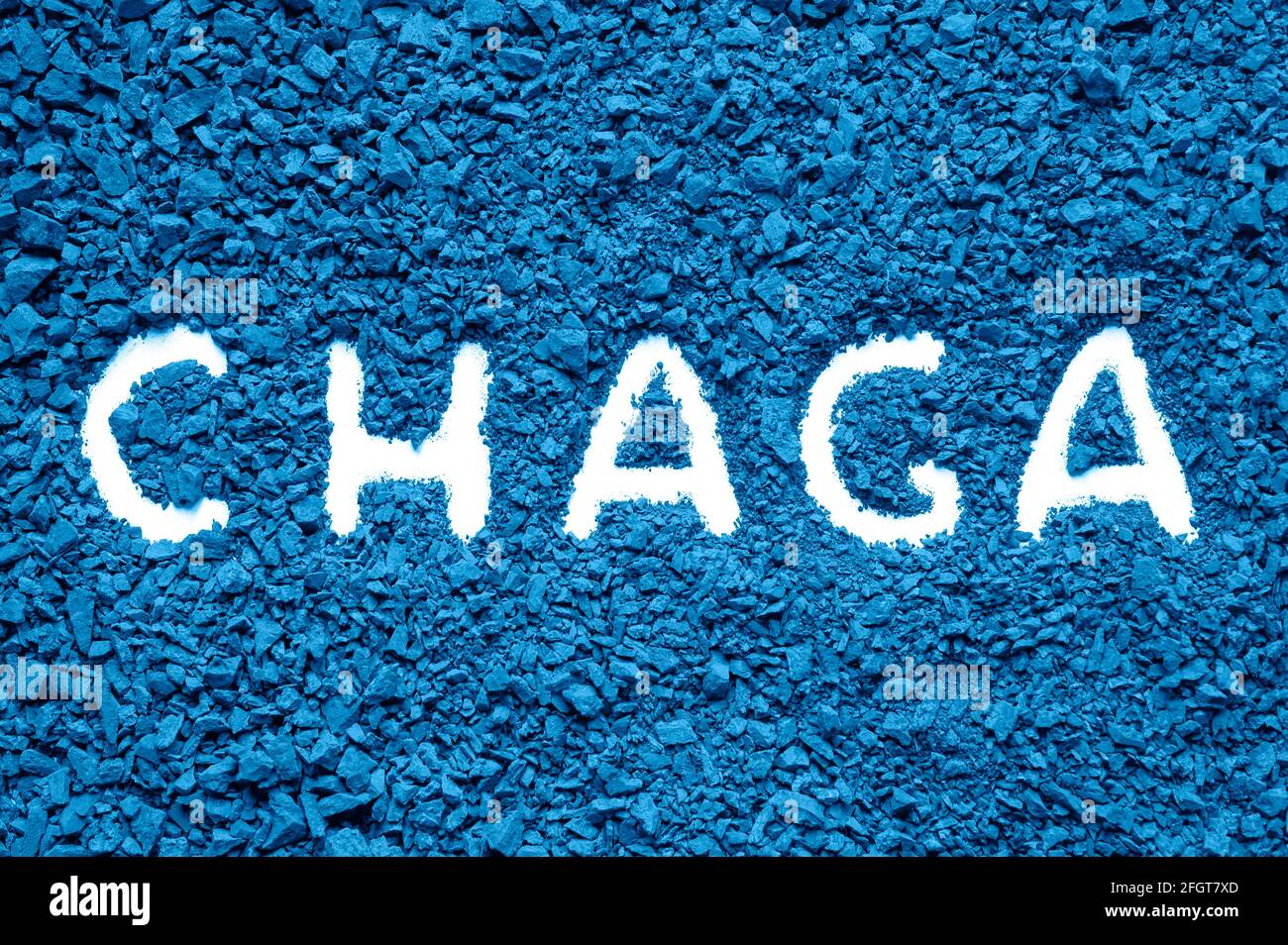 chaga mushroom. handwritten text chaga in a background of a pile of ...