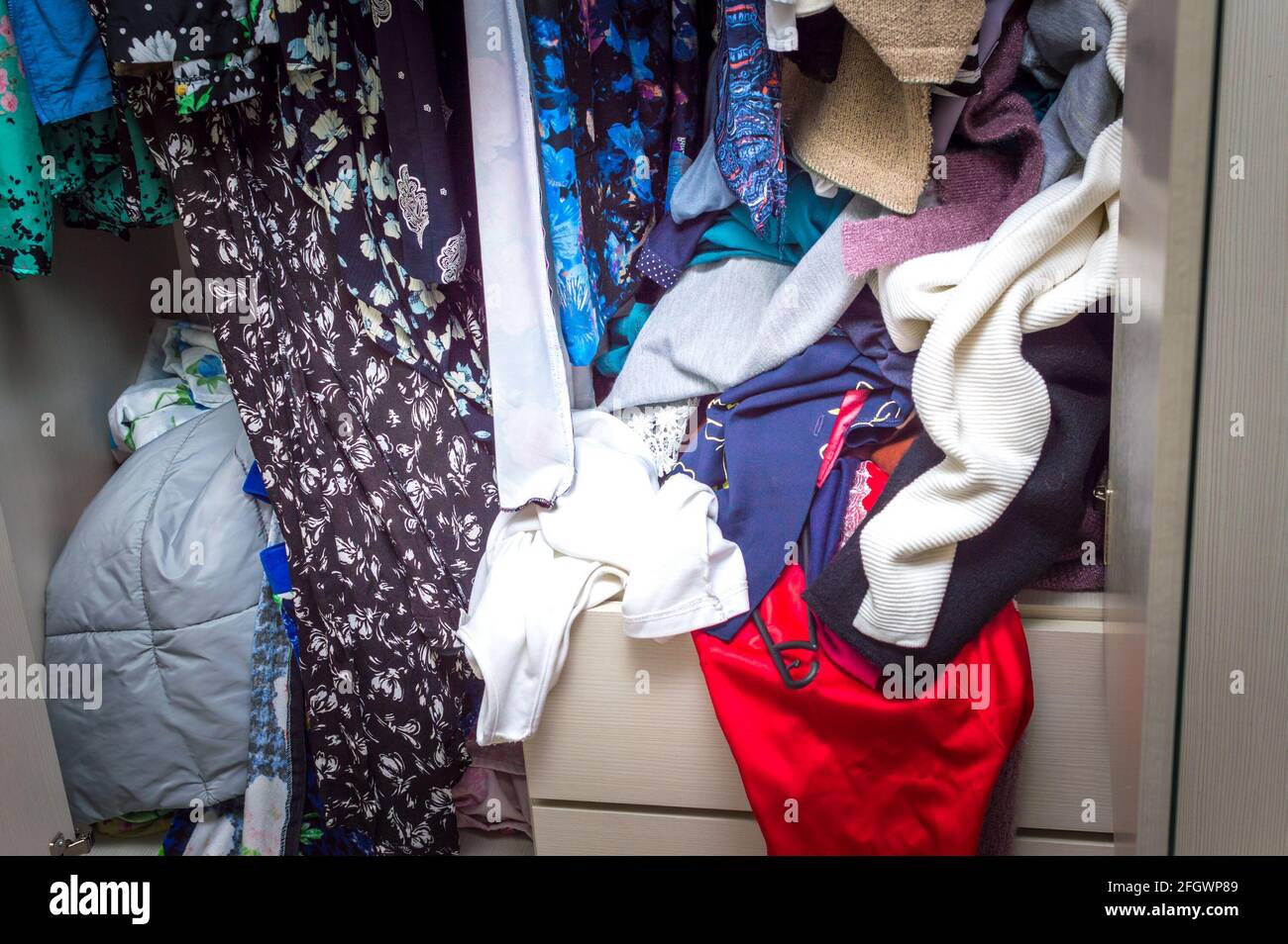 Mess in the closet. Scattered female things. Storage and order ...