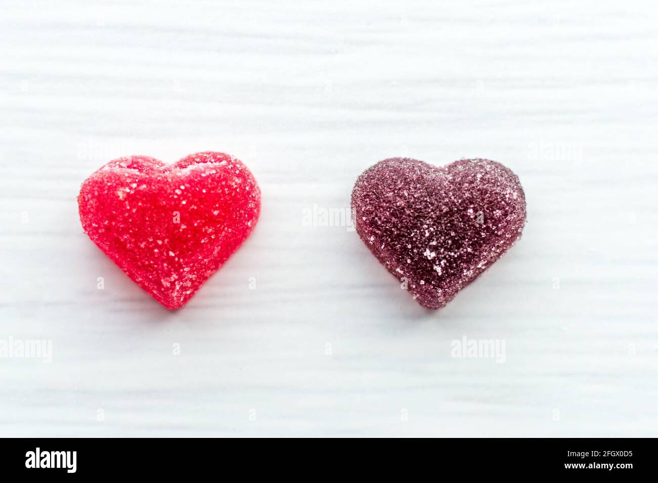Two multi-colored hearts on a white background. Concept love, romance ...