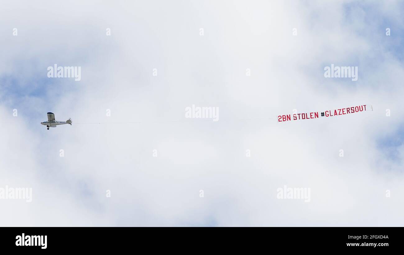 A plane flies over the ground with a banner aimed at the Manchester ...