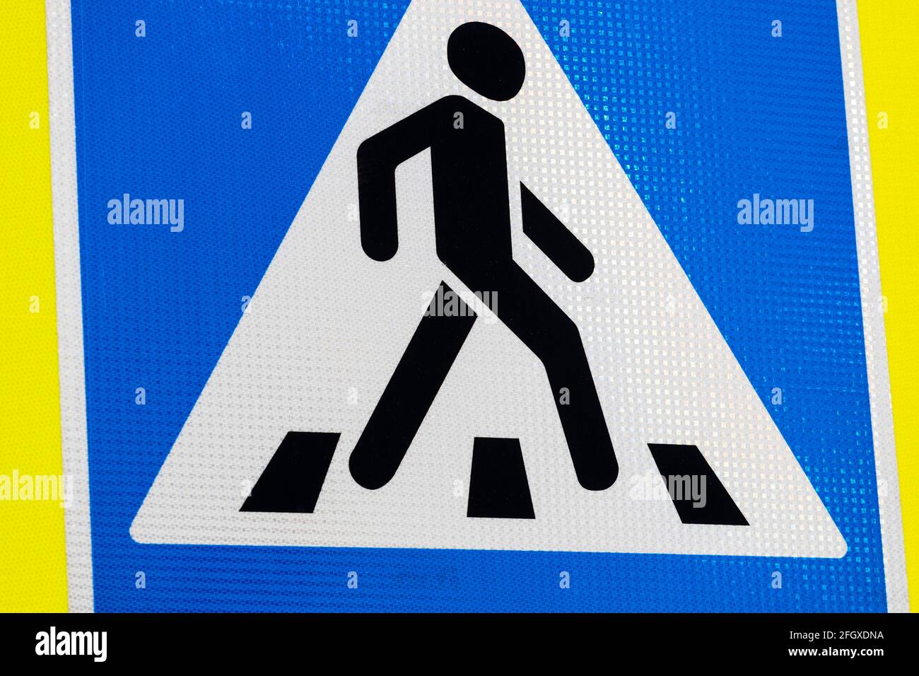 street sign man walks along a pedestrian crossing. High quality photo ...