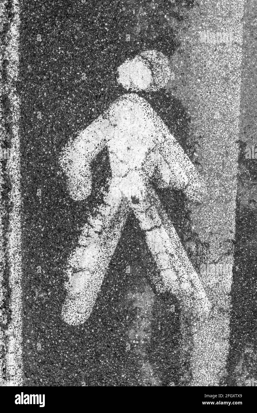 White painted sign showing pedestrian walkways on the street Stock ...