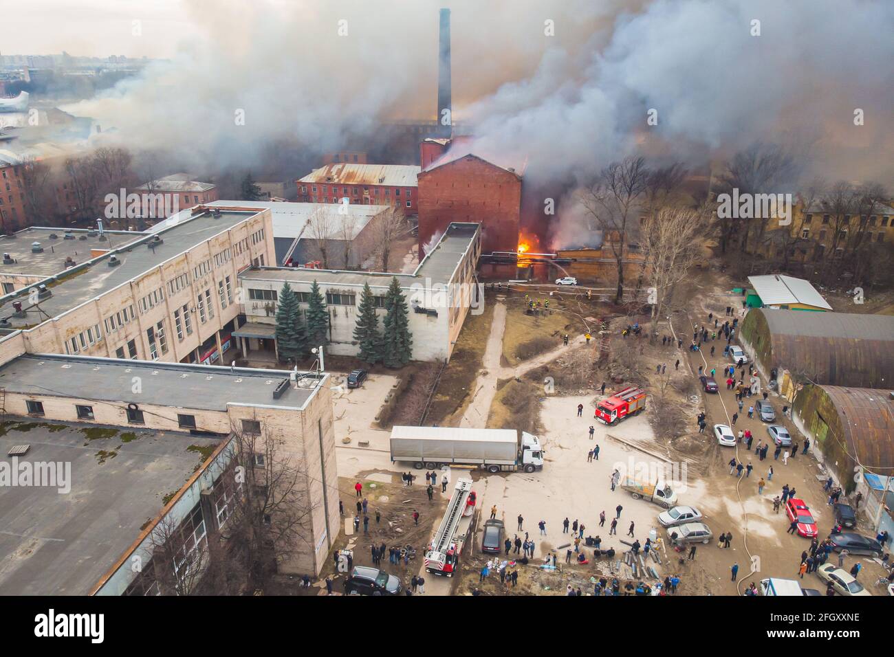 Massive large blaze fire in the city, aerial drone top view brick ...