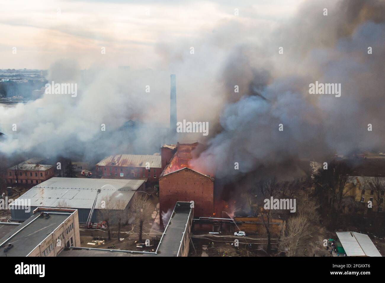 Massive large blaze fire in the city, aerial drone top view brick ...