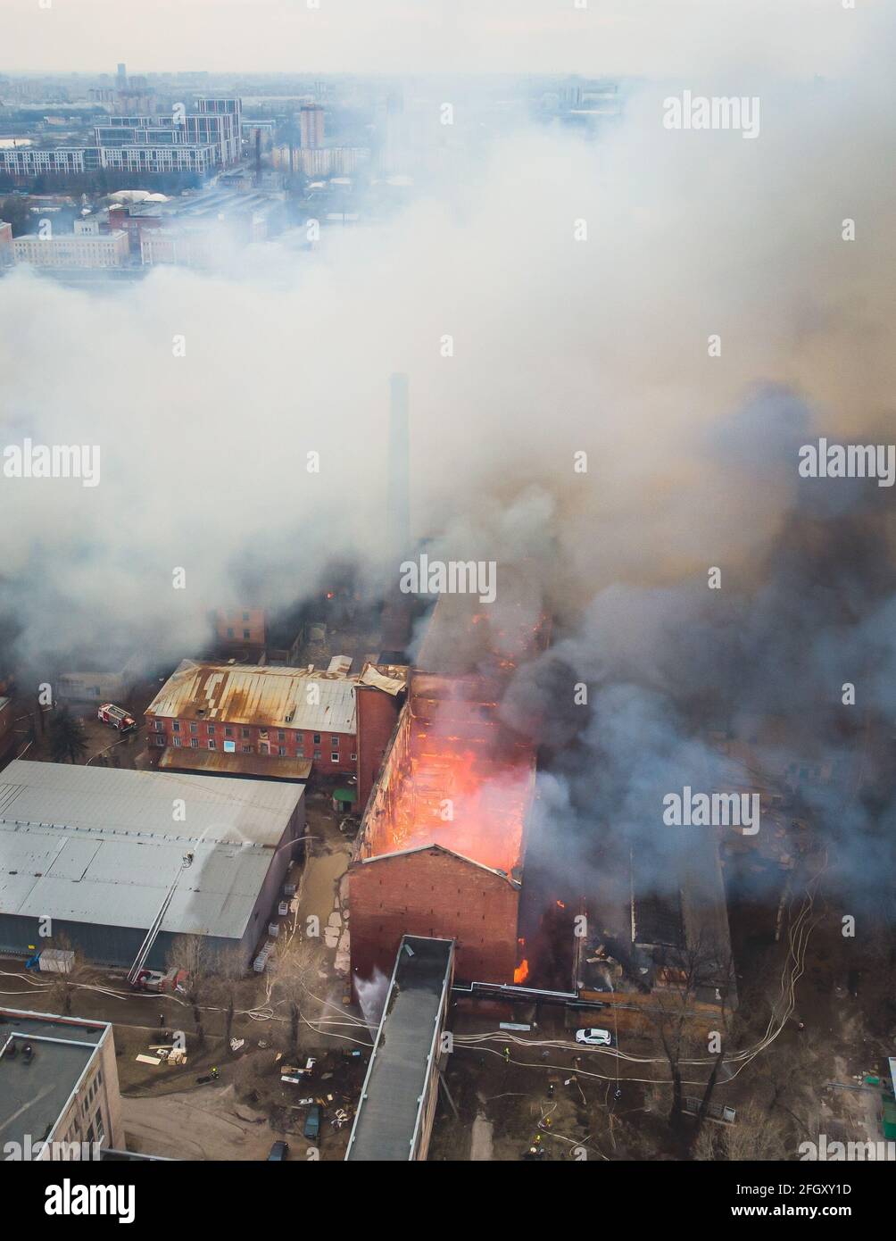 Massive large blaze fire in the city, aerial drone top view brick ...