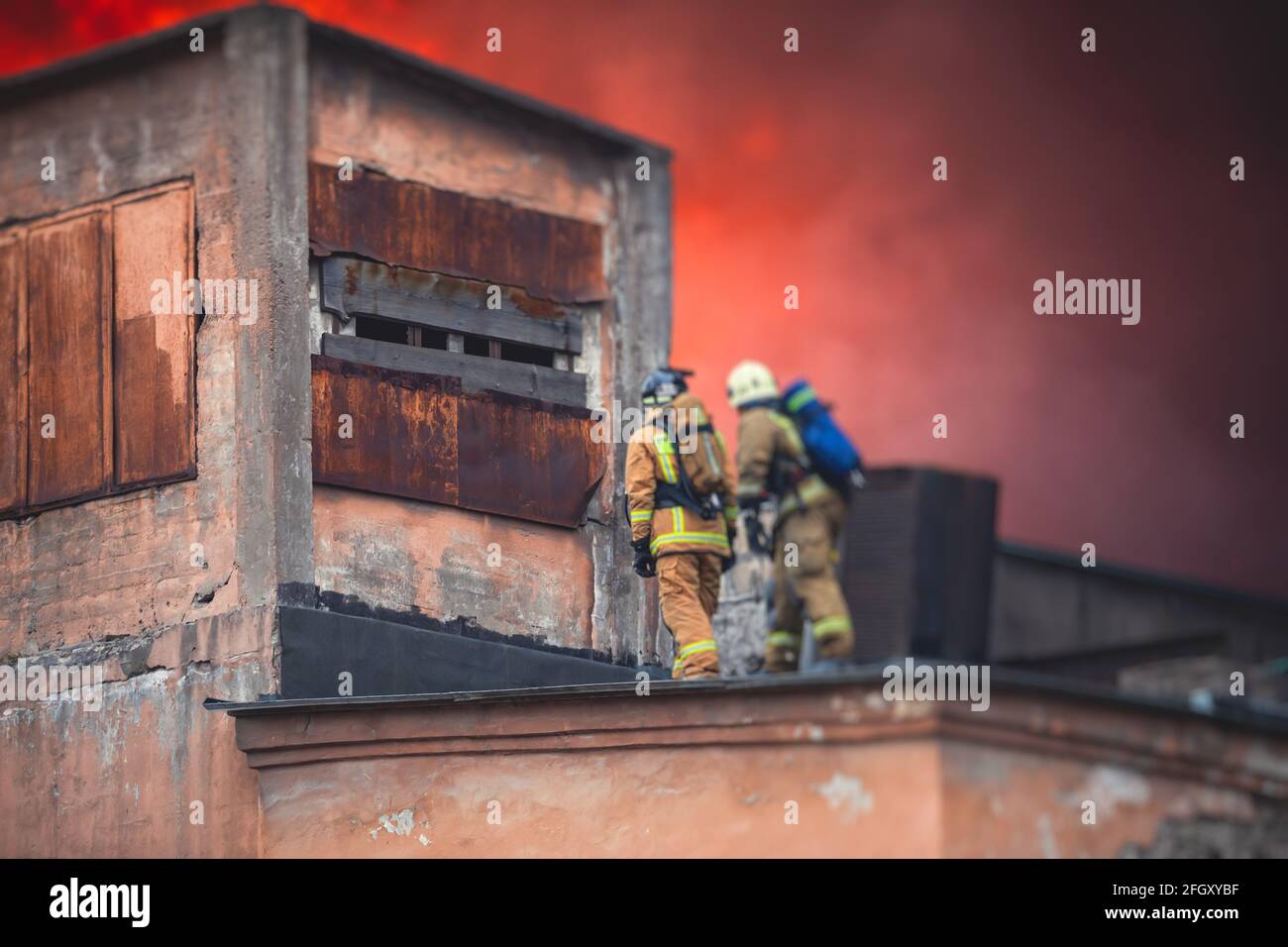 Firefighters put out large massive fire blaze, group of fire men in ...