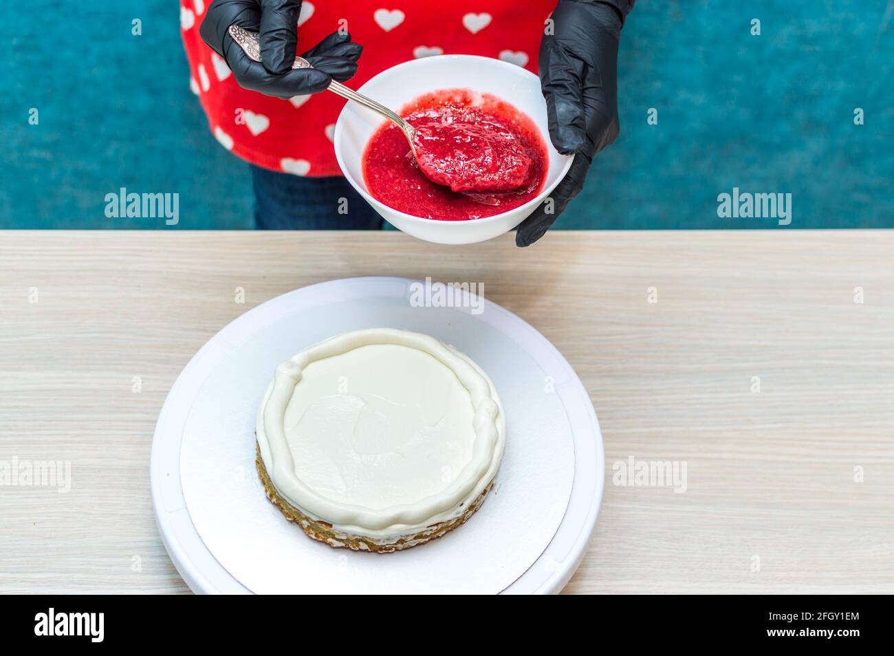 Woman making jam in kitchen hi-res stock photography and images - Alamy