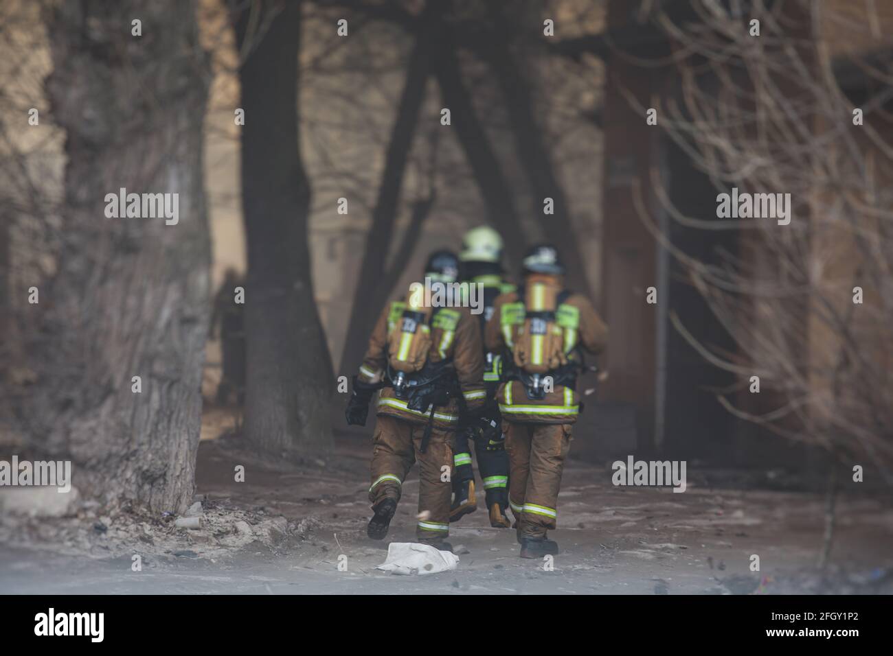 Firefighters put out large massive fire blaze, group of fire men in ...