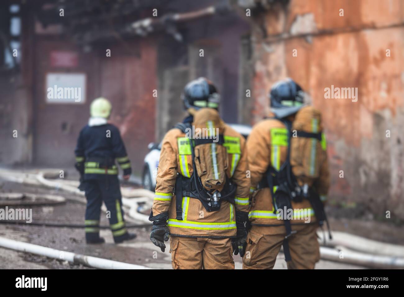 Firefighters put out large massive fire blaze, group of fire men in ...
