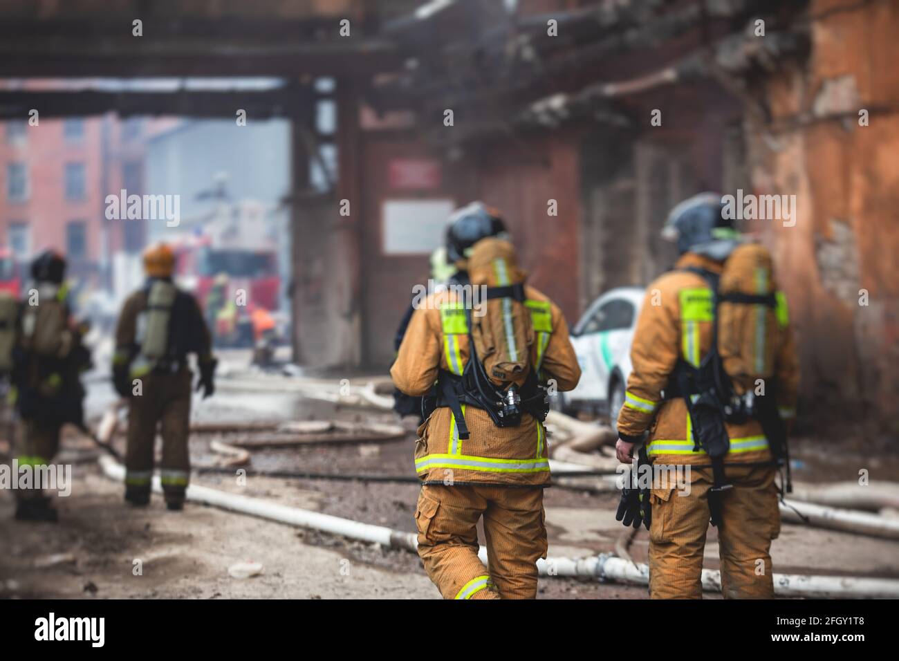 Firefighters put out large massive fire blaze, group of fire men in ...