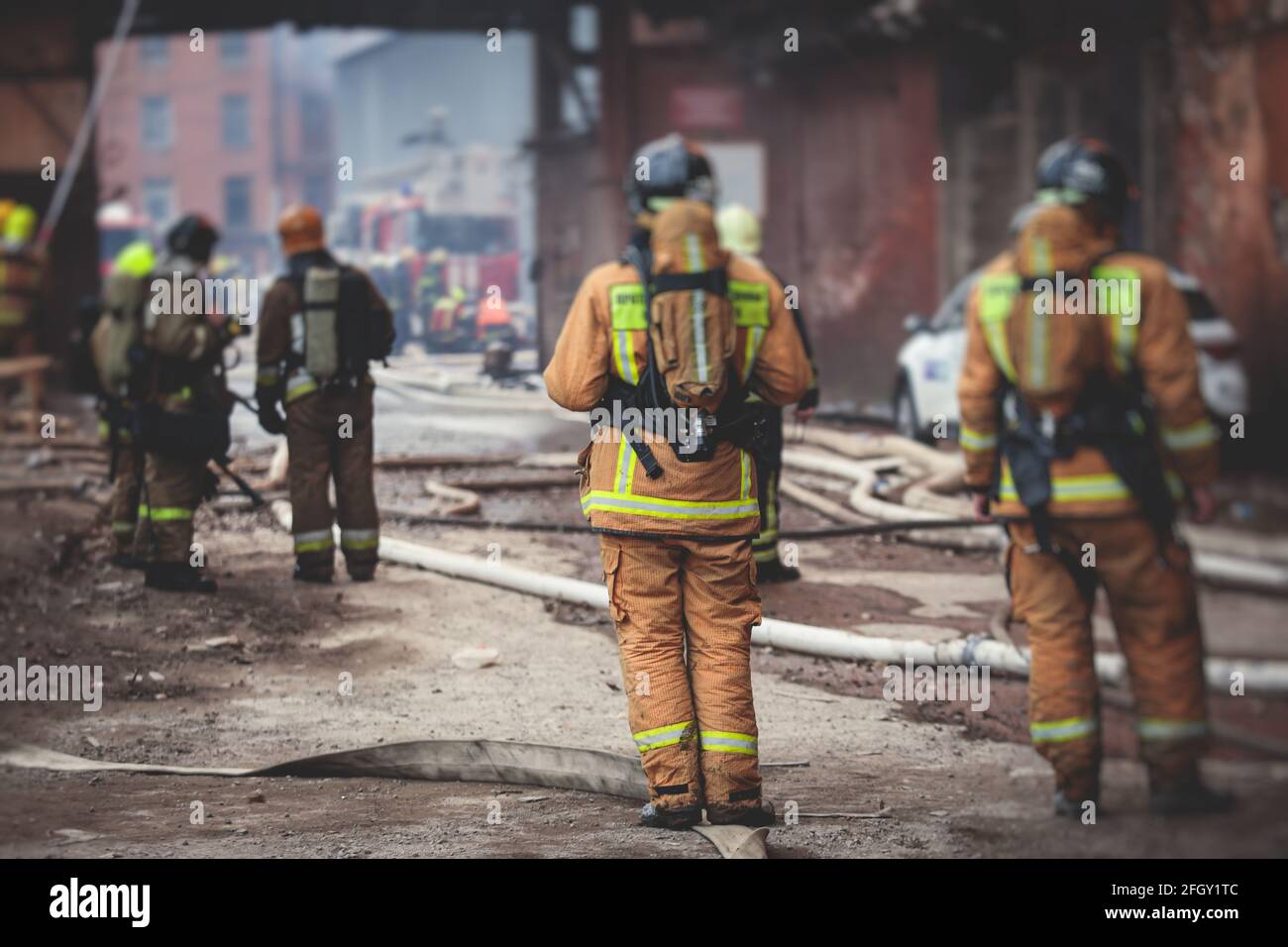 Firefighters put out large massive fire blaze, group of fire men in ...