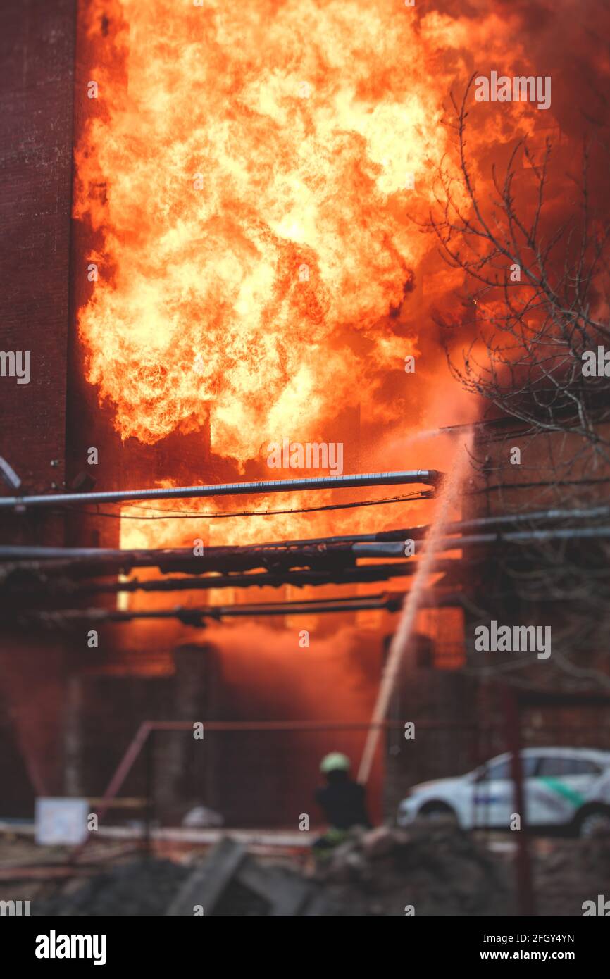 Firefighters put out large massive fire blaze, group of fire men in ...