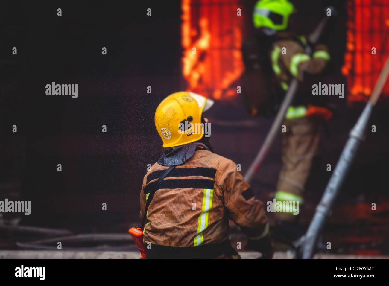 Firefighters put out large massive fire blaze, group of fire men in ...