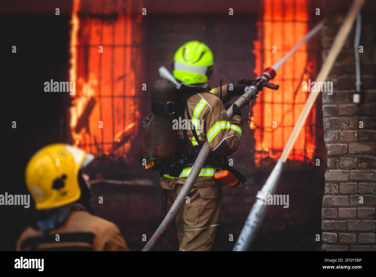 Firefighters put out large massive fire blaze, group of fire men in ...