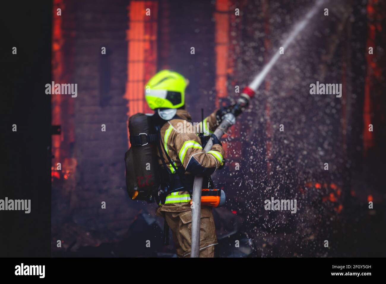 Firefighters put out large massive fire blaze, group of fire men in ...