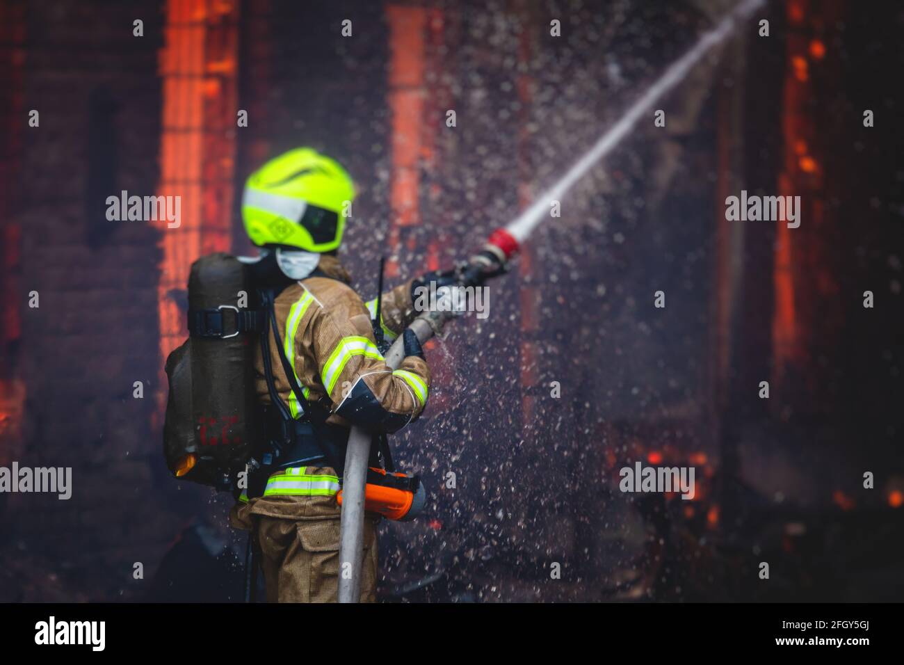 Firefighters put out large massive fire blaze, group of fire men in ...