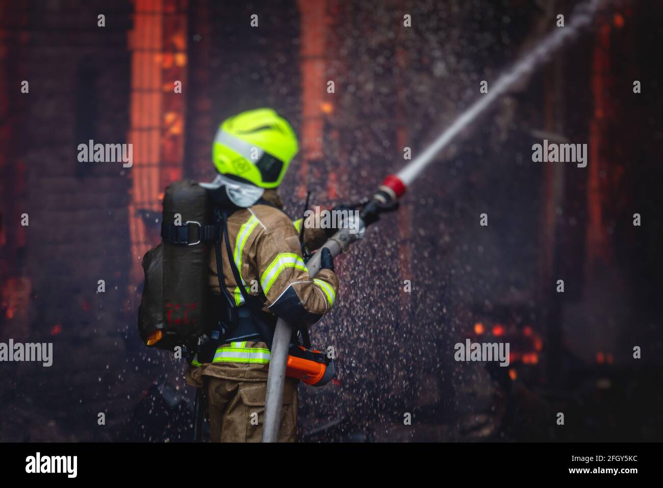 Firefighters put out large massive fire blaze, group of fire men in ...