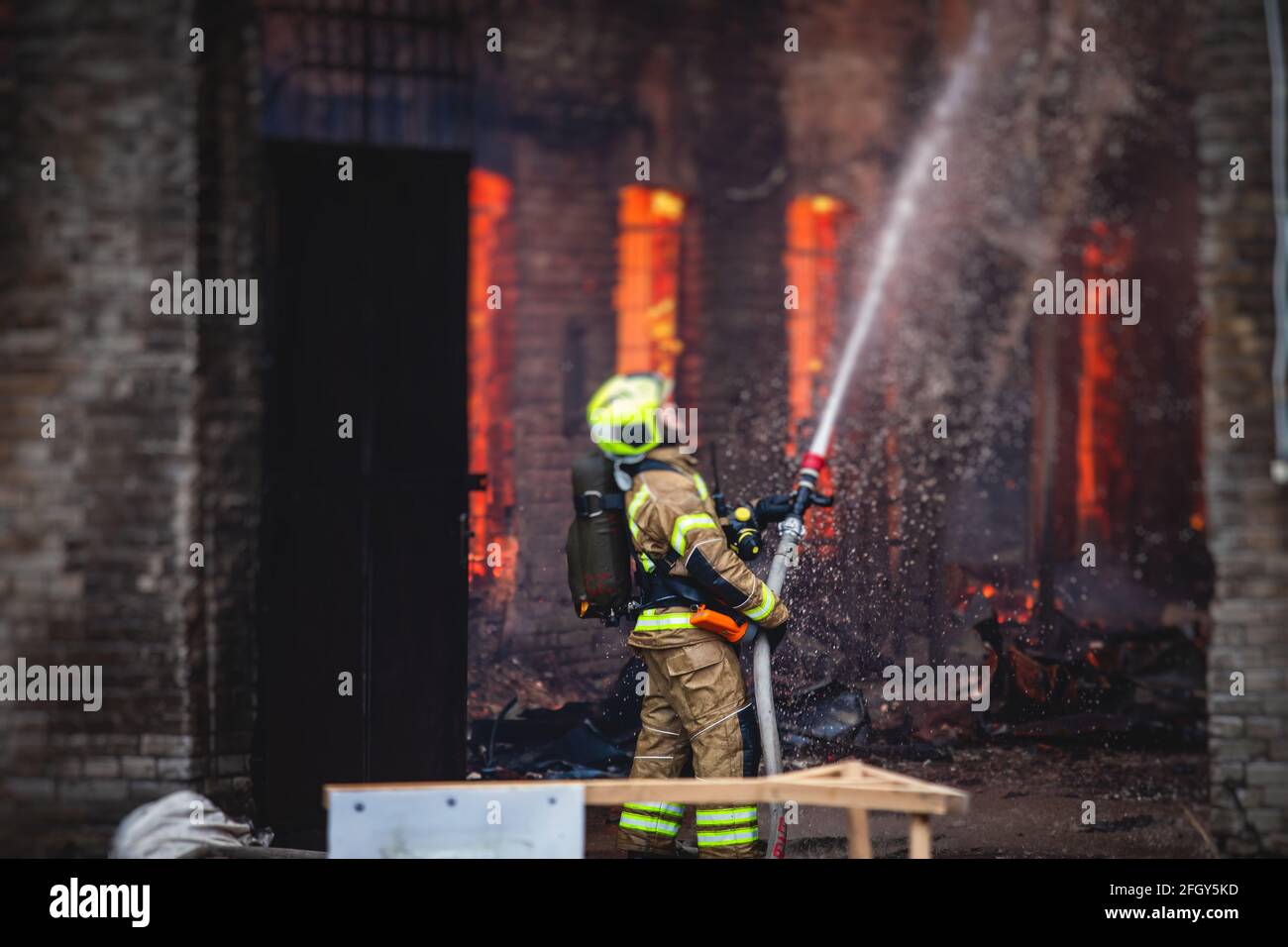 Firefighters put out large massive fire blaze, group of fire men in ...
